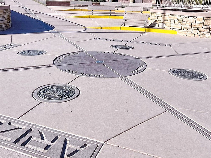The bronze disk marking the exact spot where Arizona, Colorado, New Mexico, and Utah converge in perfect harmony.
