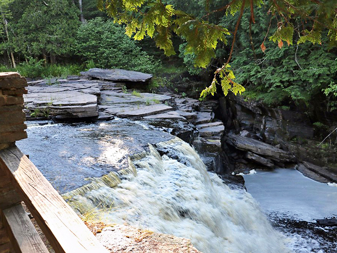 Layered rock formations tell billion-year-old stories as clear waters dance between nature's perfectly positioned stepping stones.