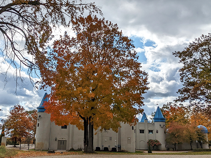 Fall transforms the castle grounds into a painter's palette, where autumn's fiery colors complement those distinctive blue turret tops.