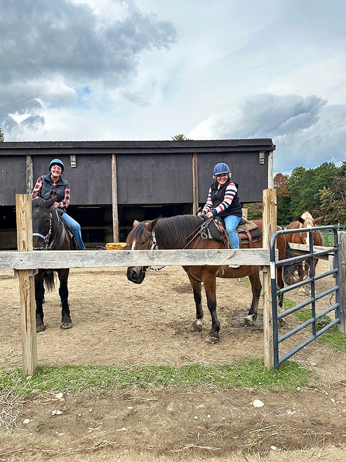 Riders prepare for their journey at the farm's staging area, where excitement builds and four-legged companions await their next adventure partners.