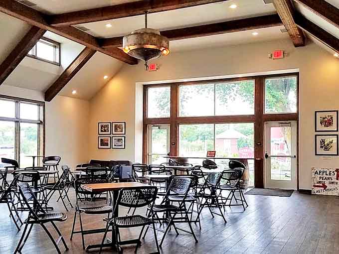 Sunlight streams through tall windows, creating the perfect ambiance for sipping local wines in comfortable surroundings.