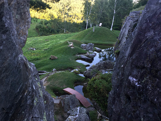 Nature's hallway, framed by ancient stone sentinels, invites explorers to discover what lies beyond the next turn.