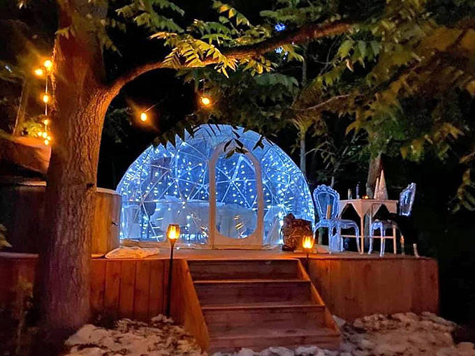 As darkness falls, the illuminated dome becomes a beacon of warmth amidst the wilderness, like a landed UFO of coziness.