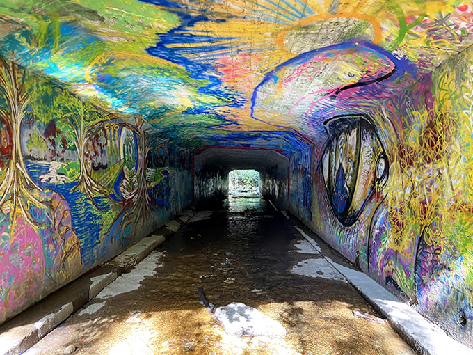 Psychedelic dreamscapes meet urban expression in this unexpected tunnel gallery, where graffiti artists have created a kaleidoscopic passage.