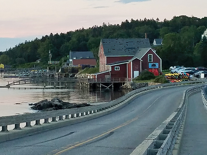 The charming red buildings of Cook's Lobster House near the bridge, a perfect spot for seafood after sightseeing.
