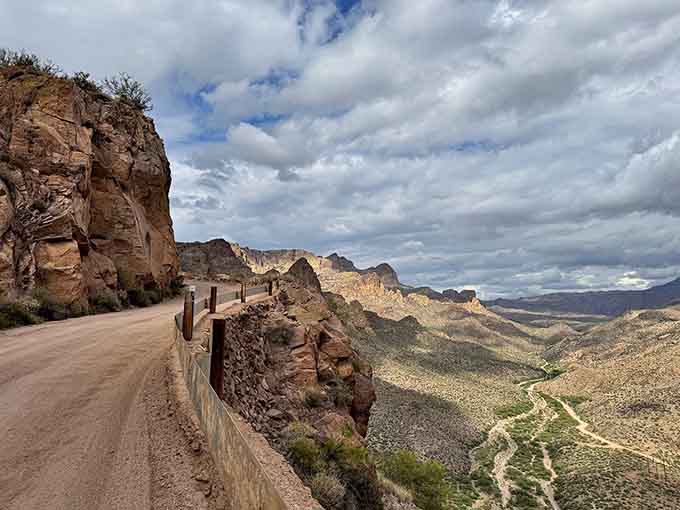 This winding mountain road clings to cliffsides with optimistic confidence, offering views that justify every white-knuckled moment.