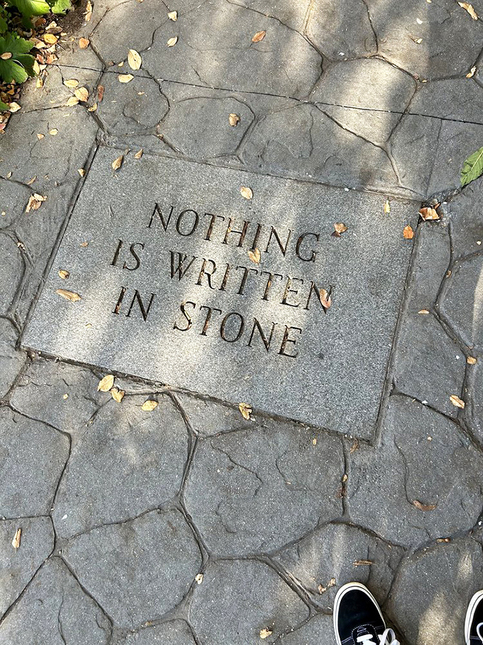 Nothing is written in stone &ndash; except this delightful bit of irony embedded in the garden path, a wink to literary minds.