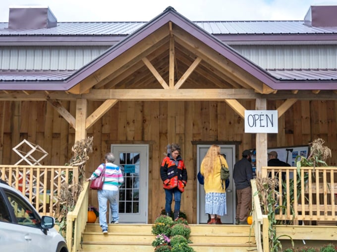 The market's entrance beckons shoppers with its simple "OPEN" sign &ndash; a gateway to an authentic shopping experience unlike any other.