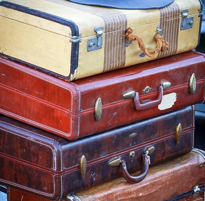 These weathered suitcases have stories to tell, each scuff and scratch a passport stamp from adventures you can only imagine.