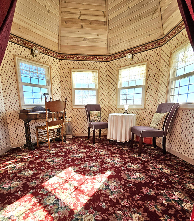 The turret room offers a cozy retreat with period wallpaper and windows that frame the Michigan landscape like living paintings.