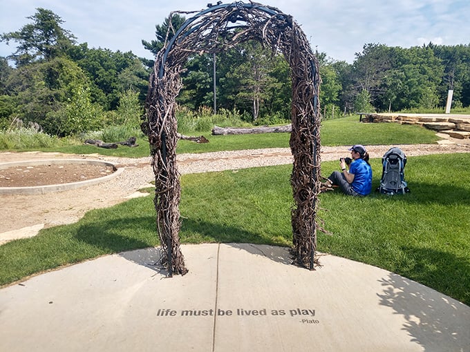 "Life must be lived as play" &ndash; this woven branch archway isn't just Instagram-worthy; it's a portal to childhood wonder.