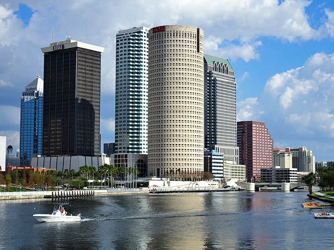 Downtown Tampa's impressive skyline creates a stunning backdrop for the Riverwalk, where cylindrical towers stand like sentinels over the water.