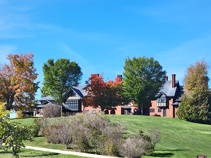 The historic Inn stands proudly against autumn's palette, a brick-and-mortar testament to agricultural elegance.