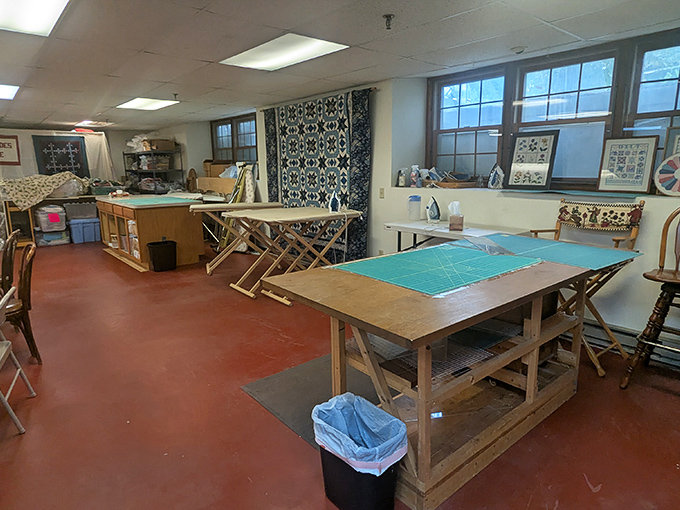 Behind every beautiful quilt lies the humble ironing board &ndash; this workspace stands ready for pressing perfection in the classroom area upstairs.