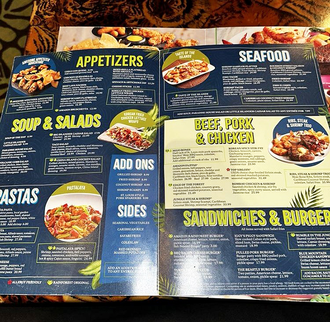 The extensive menu covers everything from pasta to seafood, with colorful sections that make choosing your rainforest feast part of the adventure.
