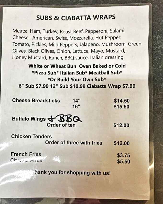 Simple pleasures done right &ndash; the menu board showcases honest food at honest prices, from hearty subs to specialty pizzas that keep locals coming back.