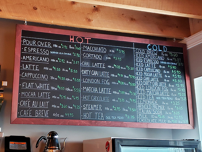 The café's menu board reads like poetry for coffee lovers—espresso, lattes, and chai waiting to fuel literary explorations.
