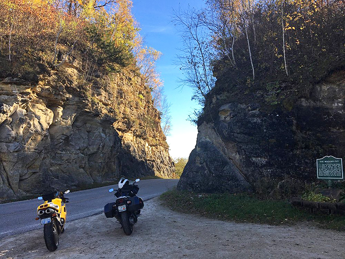 Modern motorcycles rest where horse-drawn equipment once labored, a century-spanning tribute to our evolving relationship with transportation and terrain.