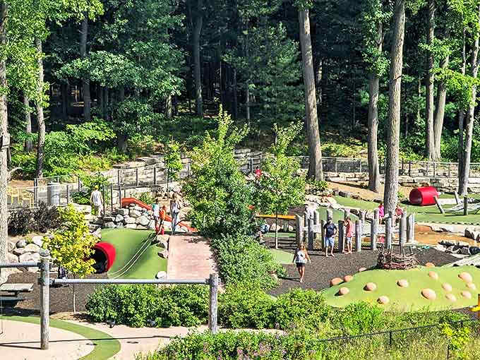 Not your average playground! Kids navigate this wonderland of natural play spaces while parents secretly wish they could join in.