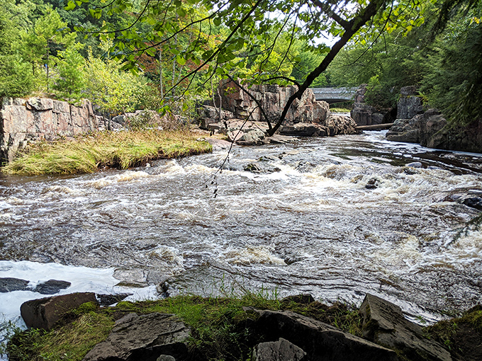 The Eau Claire River transforms into a frothy spectacle as it navigates ancient rhyolite channels, a dance of water and stone performed daily.