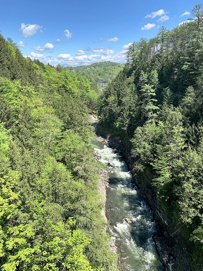 The Ottauquechee River, seen from below, tells a different story&mdash;powerful, persistent, and patient enough to carve through solid rock over millennia.
