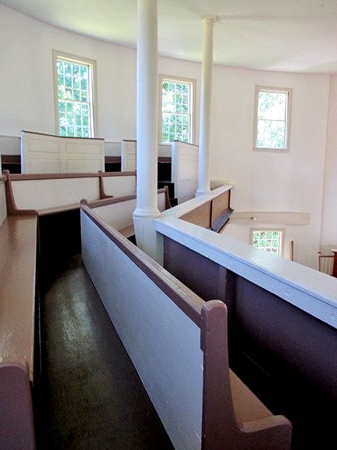 Box pews line the perimeter, creating intimate family spaces where worshippers once huddled together during three-hour sermons.