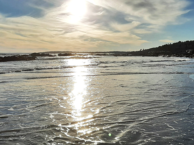 Golden hour magic transforms ordinary waves into liquid light, catching the sun's rays like nature's own disco ball.