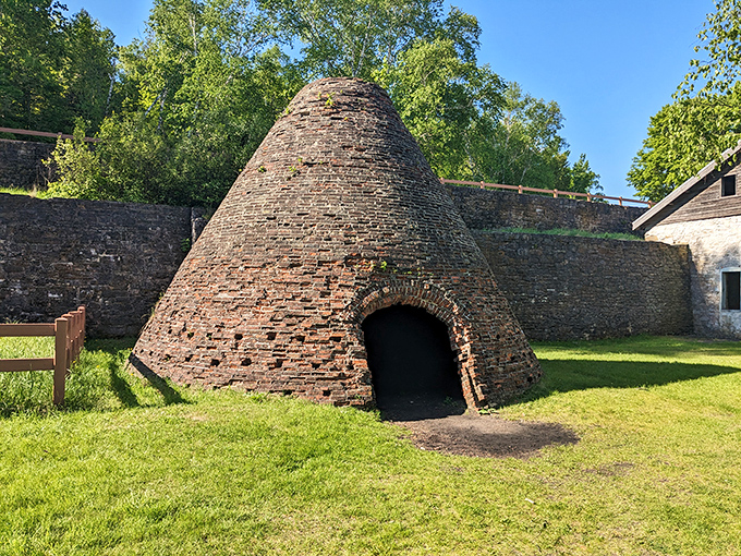 These beehive-shaped charcoal kilns once blazed with controlled fire, transforming local timber into the fuel that powered Fayette's iron industry.