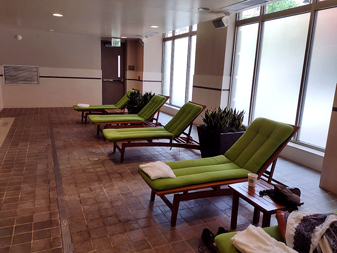 Lime-green loungers pop against neutral tones in the pool area, creating a serene oasis where time seems to slow down.