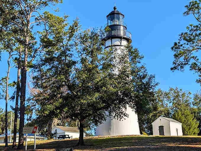 The keeper's house at Amelia Island Light welcomes visitors with its charming architecture. This hidden gem offers a glimpse into Florida's maritime history.