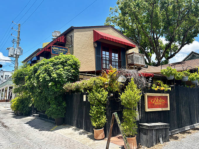 The Goblin Market hides behind a wall of greenery like a culinary secret, promising literary-inspired dishes in a setting straight from a storybook.