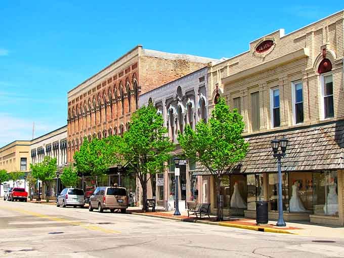Enjoying a bright downtown stroll in Bay City, Michigan, where colorful storefronts, blooming planters, and small-town charm welcome visitors warmly.