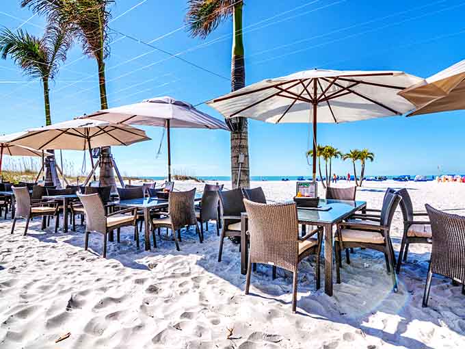 Beach umbrellas, white sand, and fresh seafood create the perfect recipe for a lazy afternoon in paradise.