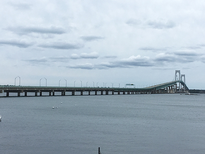 The Jamestown Verrazzano Bridge stretches across Narragansett Bay like a giant concrete ribbon. Even on cloudy days, this engineering marvel impresses.