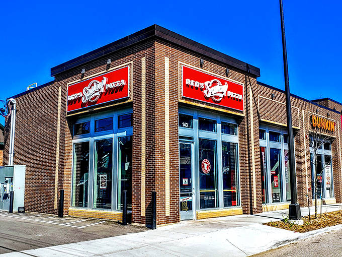 Red's Savoy's distinctive brick building and bold signage stands as a beloved landmark for Minnesota pizza enthusiasts.