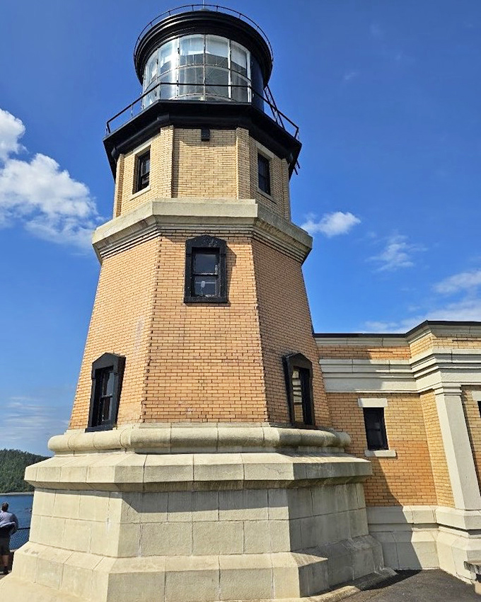 Split Rock Lighthouse stands sentinel on its 130-foot cliff, a historic beacon that has guided ships across Lake Superior's unpredictable waters since 1910.
