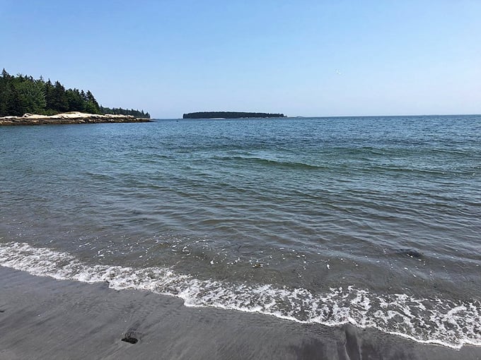 Birch Point State Park's calm waters reflect the sky like nature's mirror, inviting even the most hesitant swimmers.