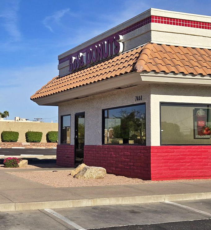 BoSa Donuts' distinctive red and white building stands out like a sugary oasis in the desert landscape.