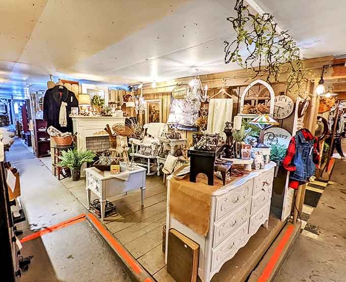 The interior showcases a thoughtful arrangement of antique furniture, lighting fixtures, and home decor with rustic farmhouse appeal.