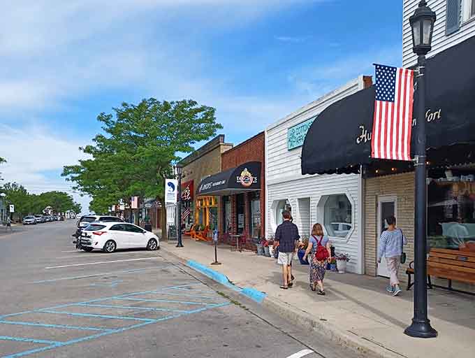 Frankfort's downtown shops stand ready to welcome visitors with colorful facades that brighten even the cloudiest Michigan day.