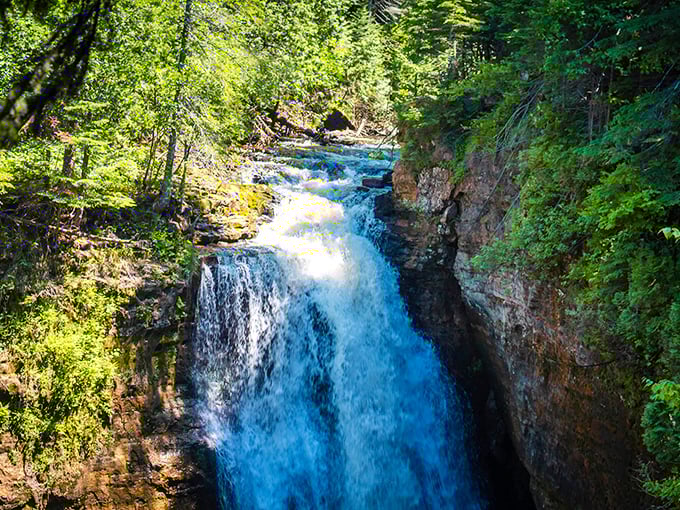 The powerful drop of Miners Falls demonstrates nature's raw energy, carving its path through ancient rock in Pictured Rocks National Lakeshore.