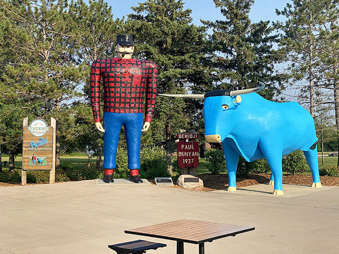 Paul Bunyan and his faithful blue ox Babe stand tall against Minnesota's blue skies, ready for selfies and creating childhood memories.