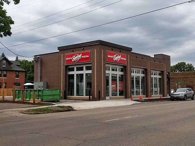 The classic storefront of Red's Savoy promises authentic Minnesota-style pizza that's been winning fans for generations.