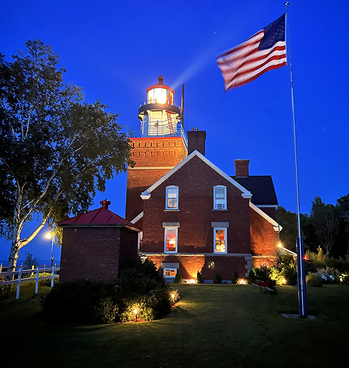 As twilight embraces the lighthouse, its beacon springs to life &ndash; a nightlight for giants that's been guiding sailors since the 1890s.