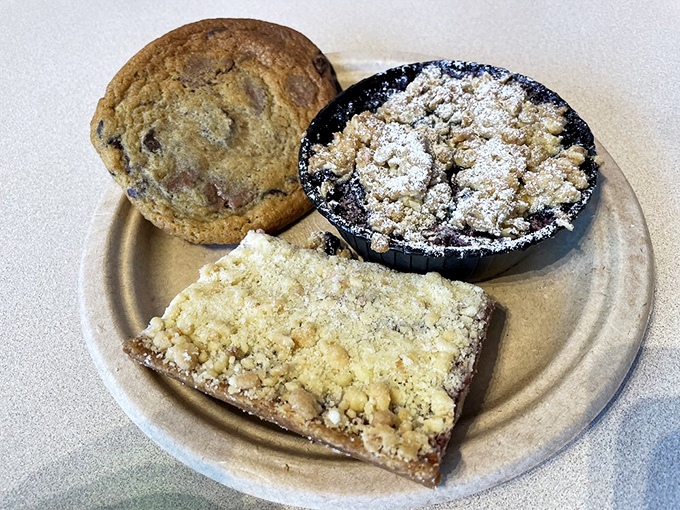 This isn't just dessert; it's Maine summer captured in a dish. The blueberry cobbler sits alongside a cookie and crumb bar that would make grandma jealous.