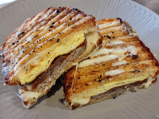 Breakfast sandwich perfection &ndash; golden-grilled bread hugging melty cheese and savory fillings that would make any morning better.