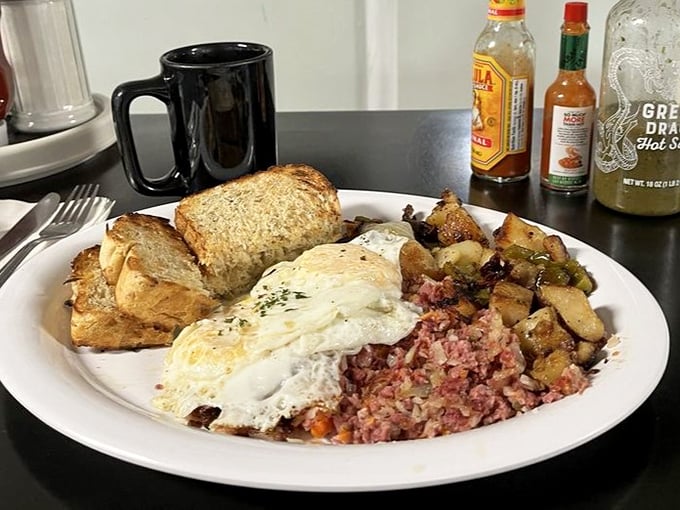 Breakfast perfection on a plate: eggs, corned beef hash, and toast that'll make you question why you ever eat anywhere else.