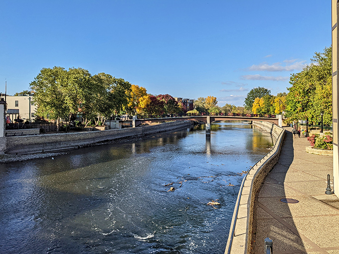 The gentle flow of the Cannon River creates a peaceful backdrop for riverside strolls, its waters reflecting centuries of Northfield history.