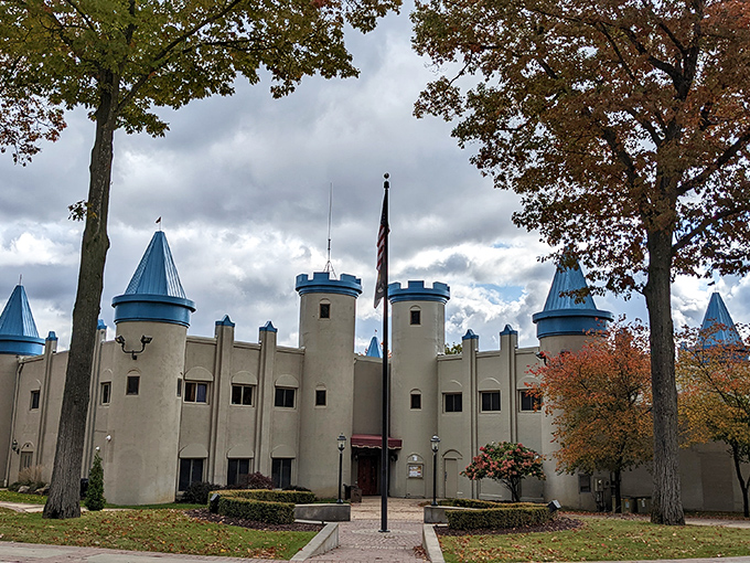 The castle's architectural details stand proudly against autumn's canvas, proving that medieval aesthetics feel right at home in Michigan's landscape.