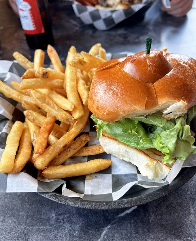 This isn't just a burger and fries – it's edible therapy on a pretzel bun with golden potato sidekicks that'll make you forget all your worries.